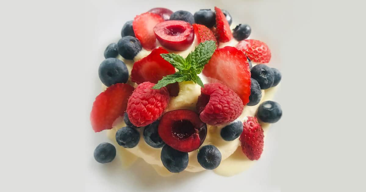 Crispy Meringue Pavlova with Berries - Eliza Cross